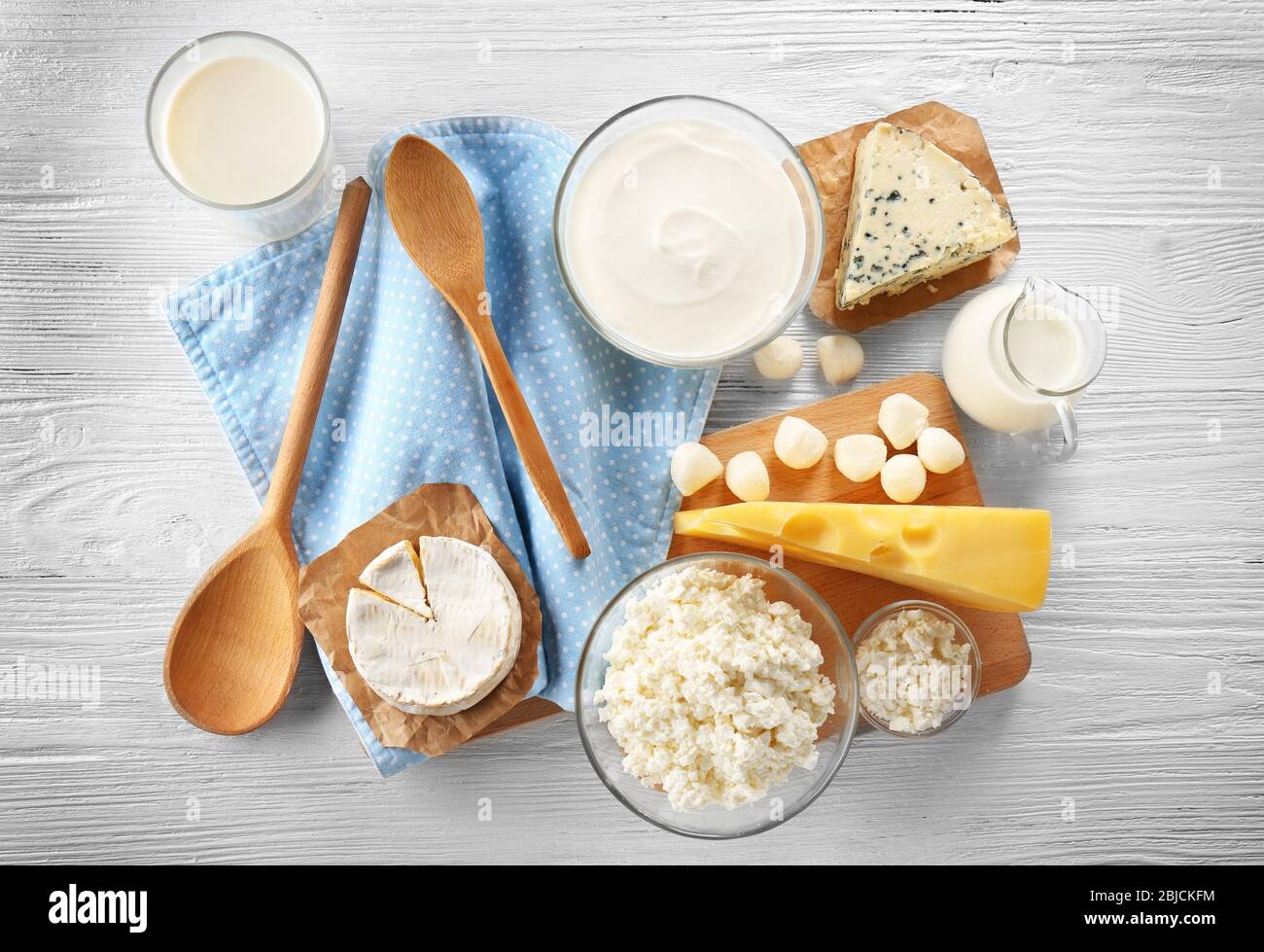 Different types of dairy products on wooden background Stock Photo - Alamy