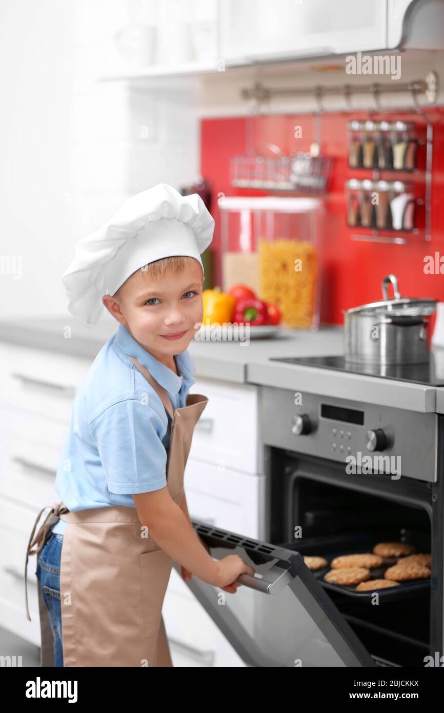 Little boy cooking in the kitchen Stock Photo - Alamy