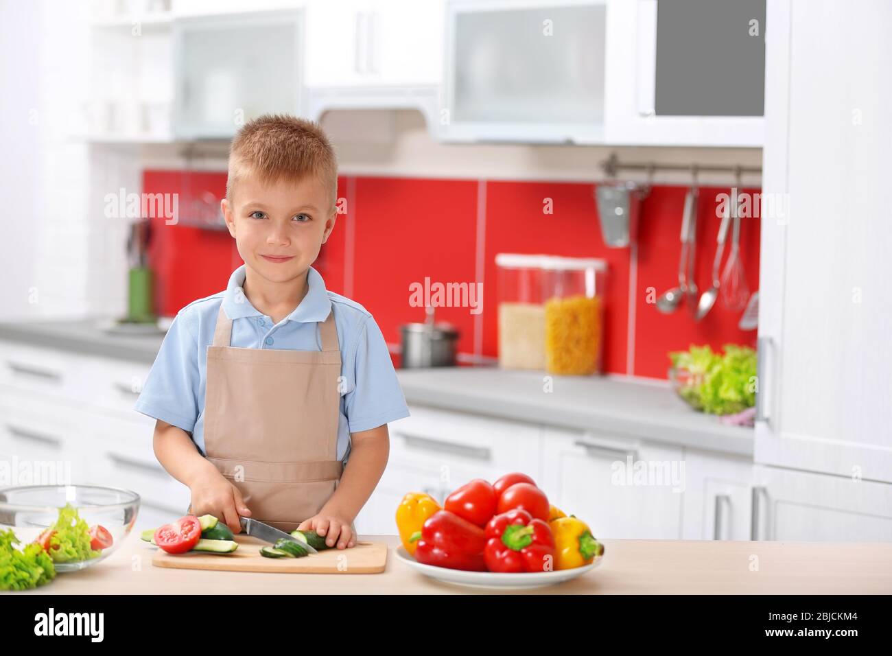 Little boy cooking in the kitchen Stock Photo - Alamy