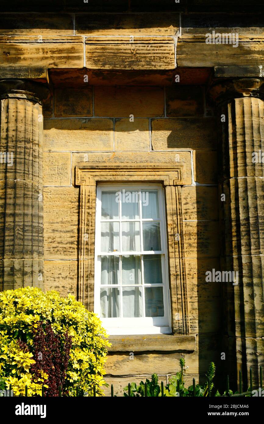 Window of lodge built into sandstone arch / gatehouse at entrance to ...