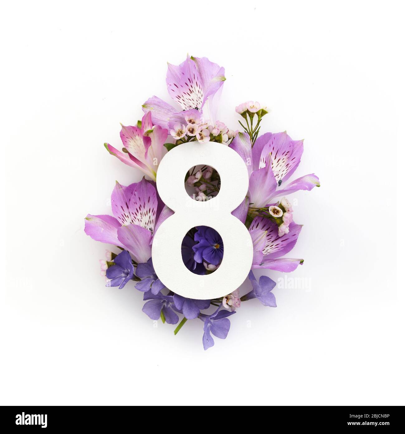 Creative layout with colourful flowers and number eight. Flat lay. Top ...
