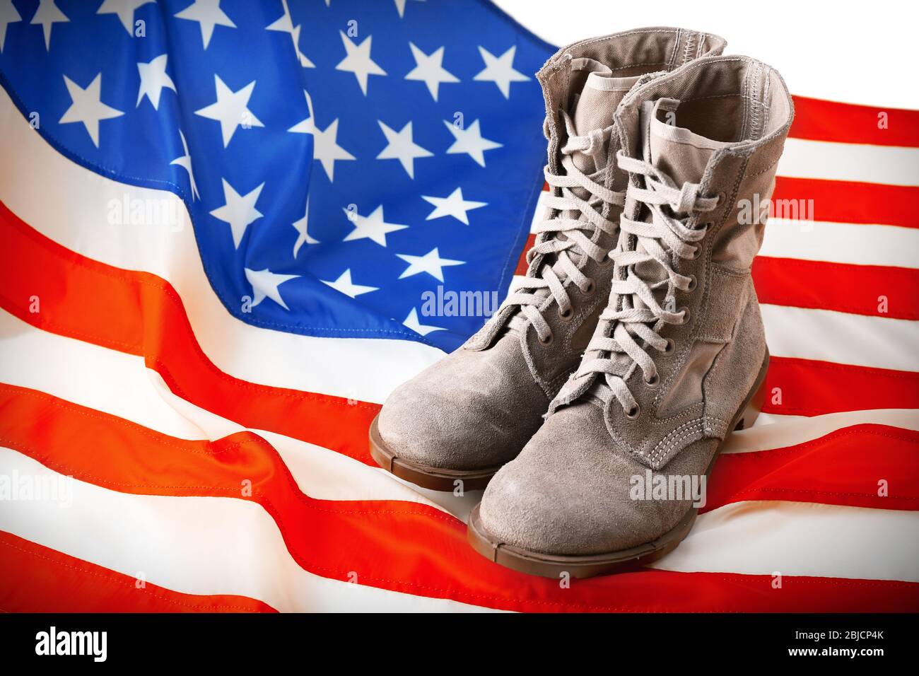 Pair of combat boots with USA flag, close up view Stock Photo - Alamy