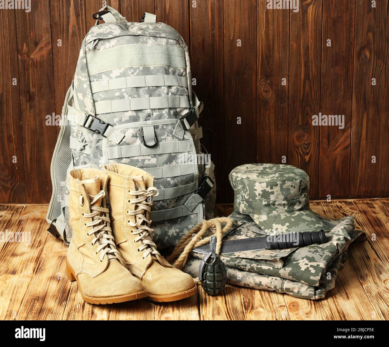 Set of military outfit on wooden background Stock Photo - Alamy