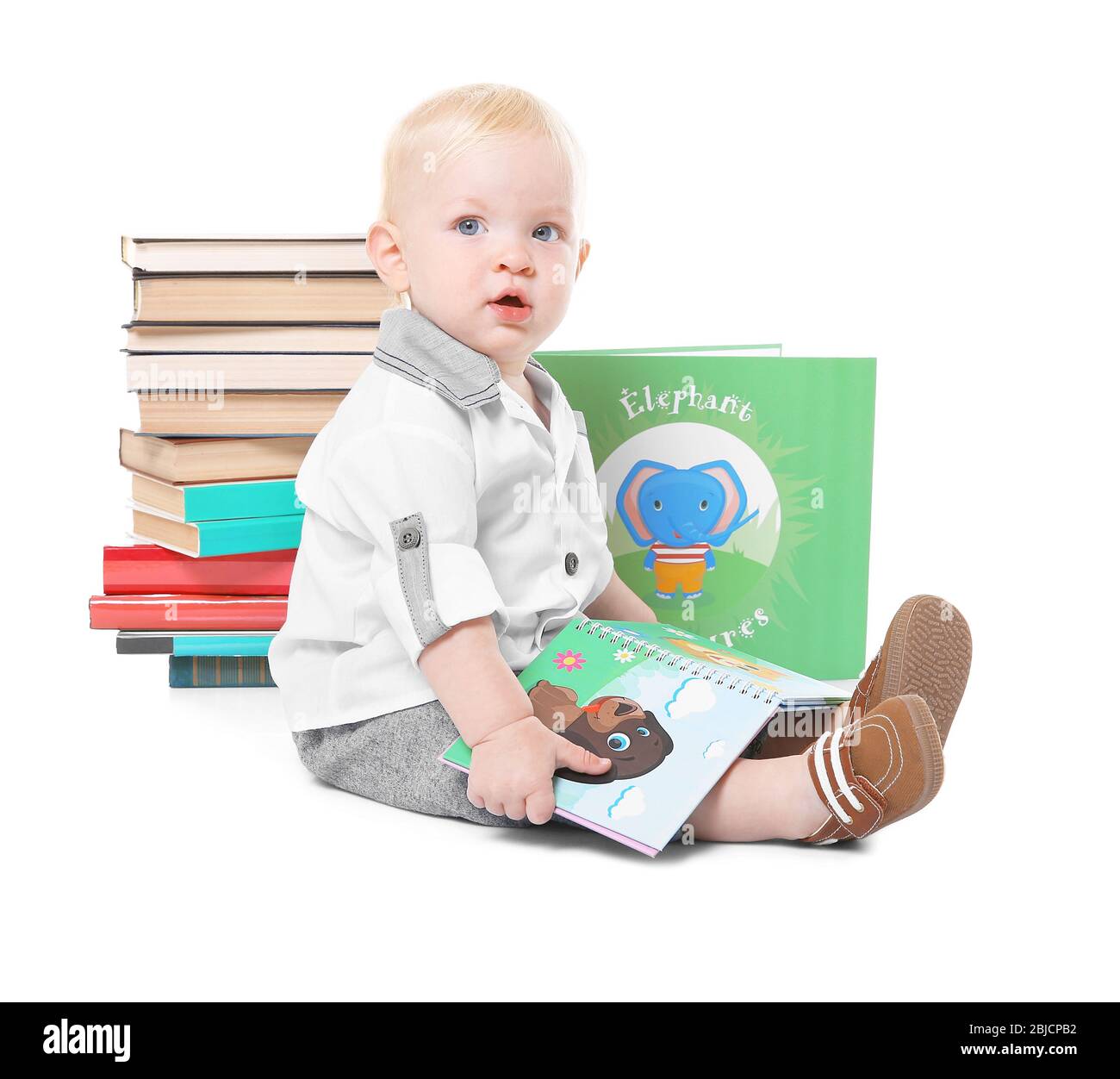 Baby boy with books on white background Stock Photo - Alamy