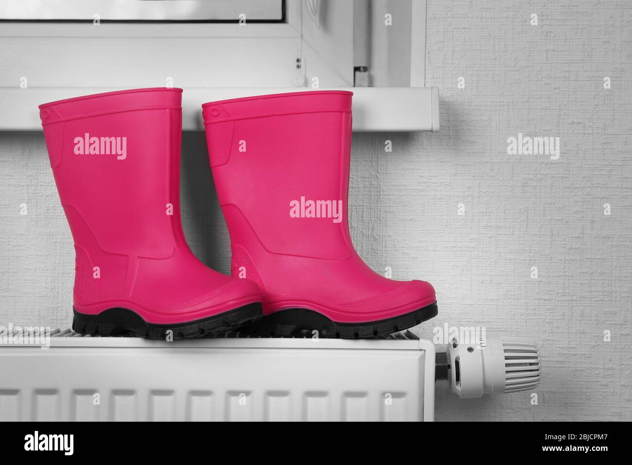 Heating radiator with rubber boots Stock Photo - Alamy