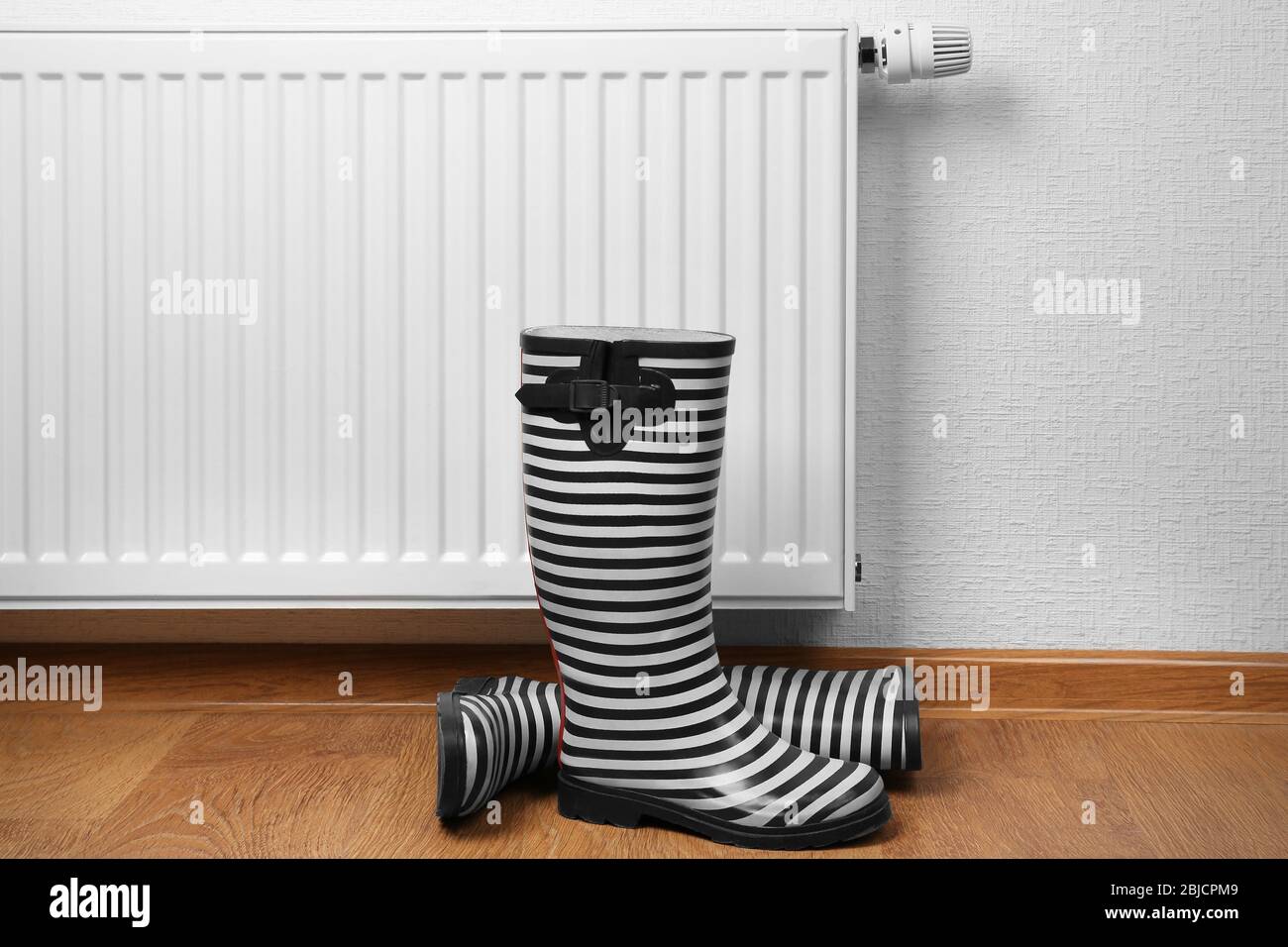 Heating radiator with rubber boots Stock Photo - Alamy