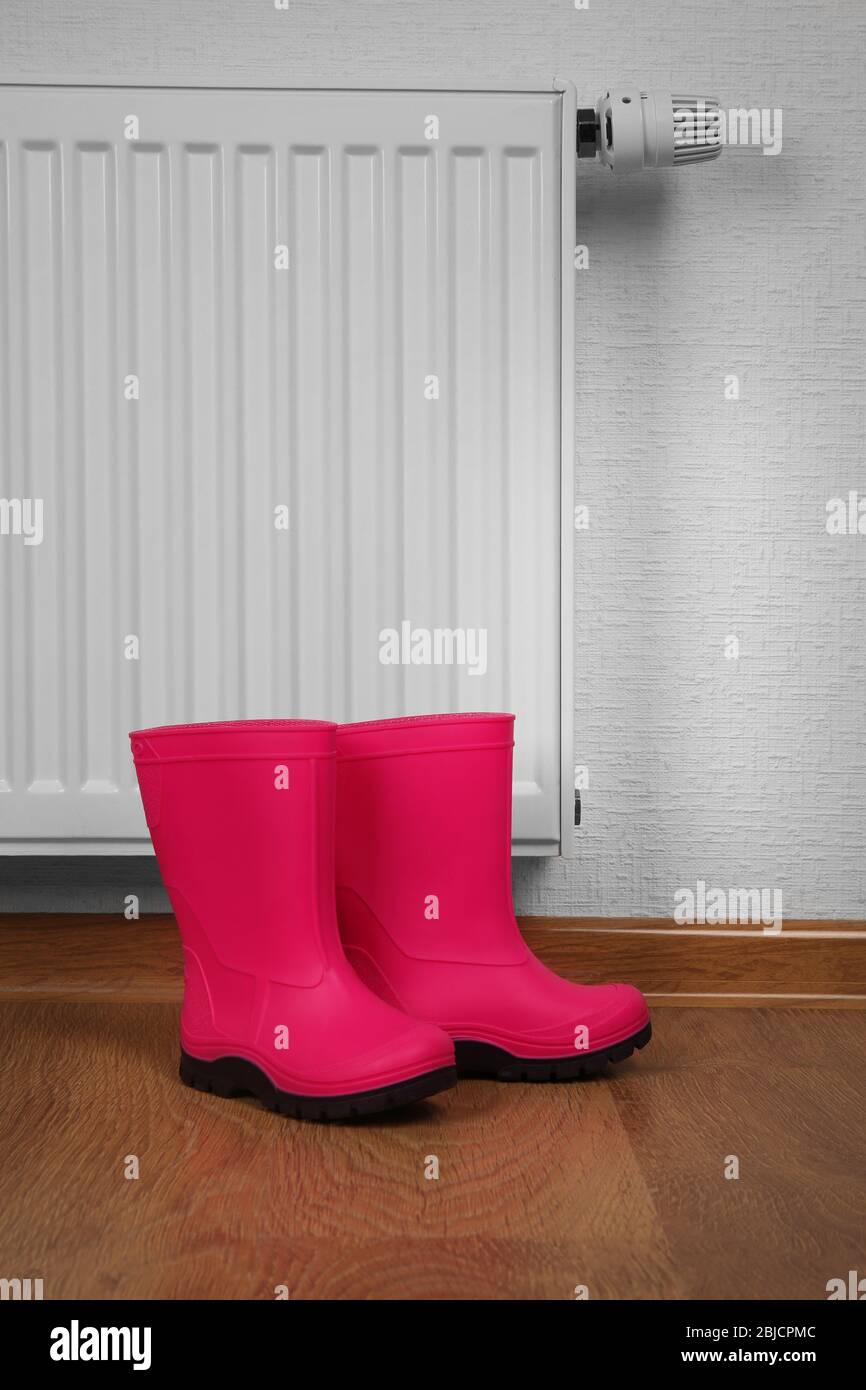 Heating radiator with rubber boots Stock Photo - Alamy