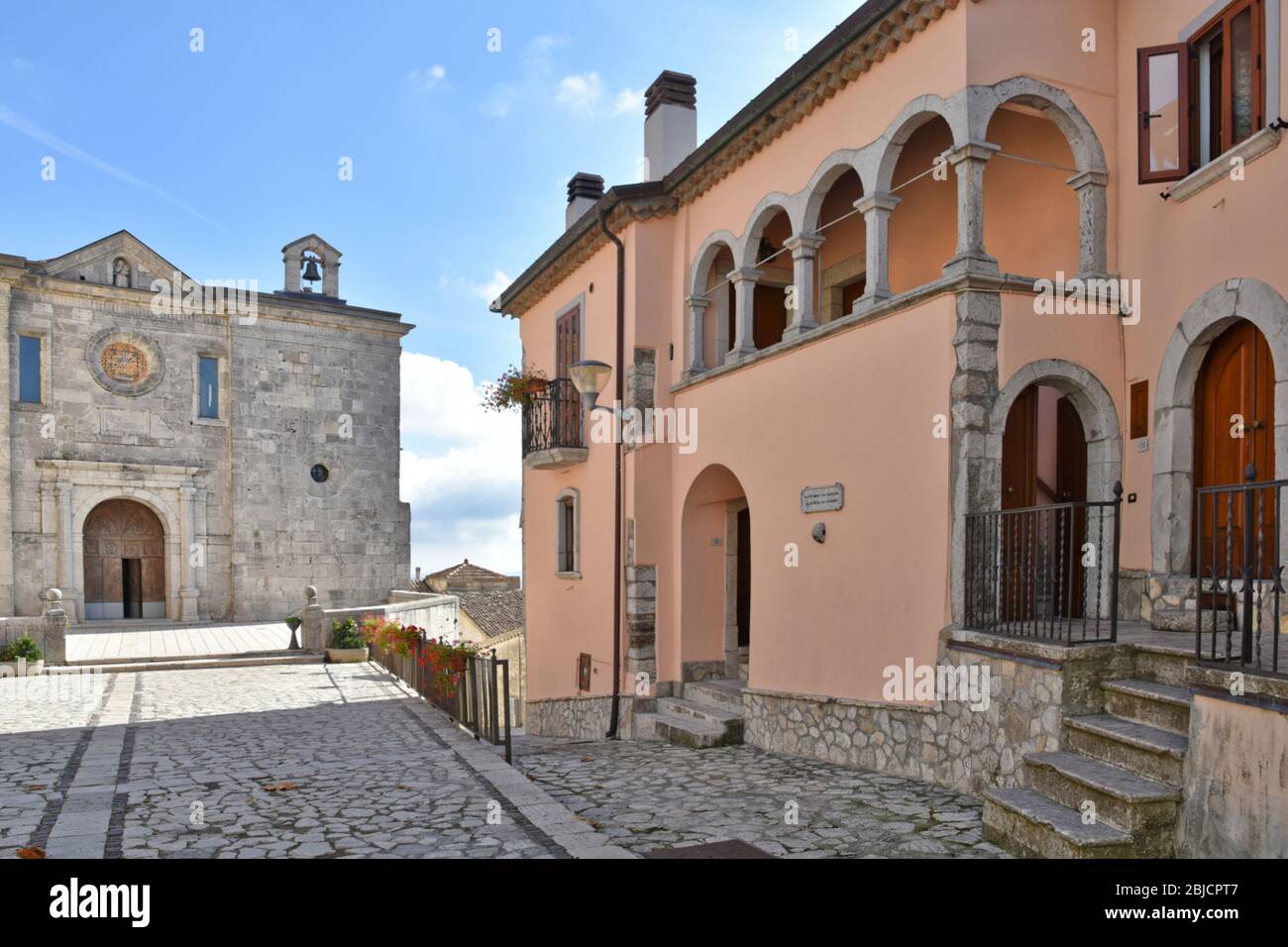 A small road between the houses of the village of Guardia Lombardi in ...