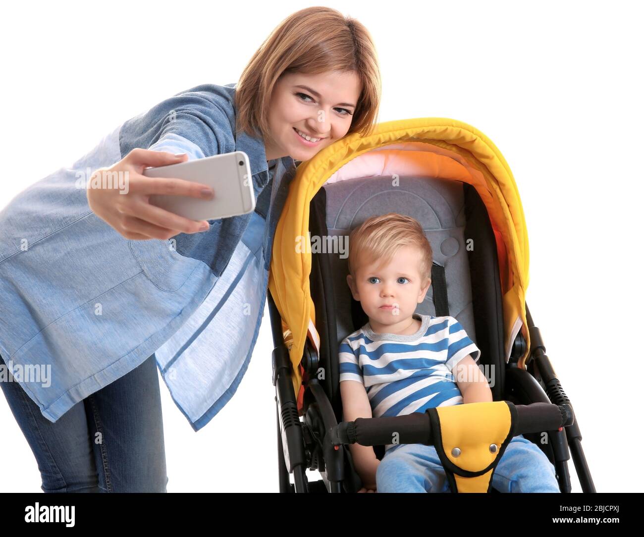 Mother with baby in pram taking photo Stock Photo - Alamy