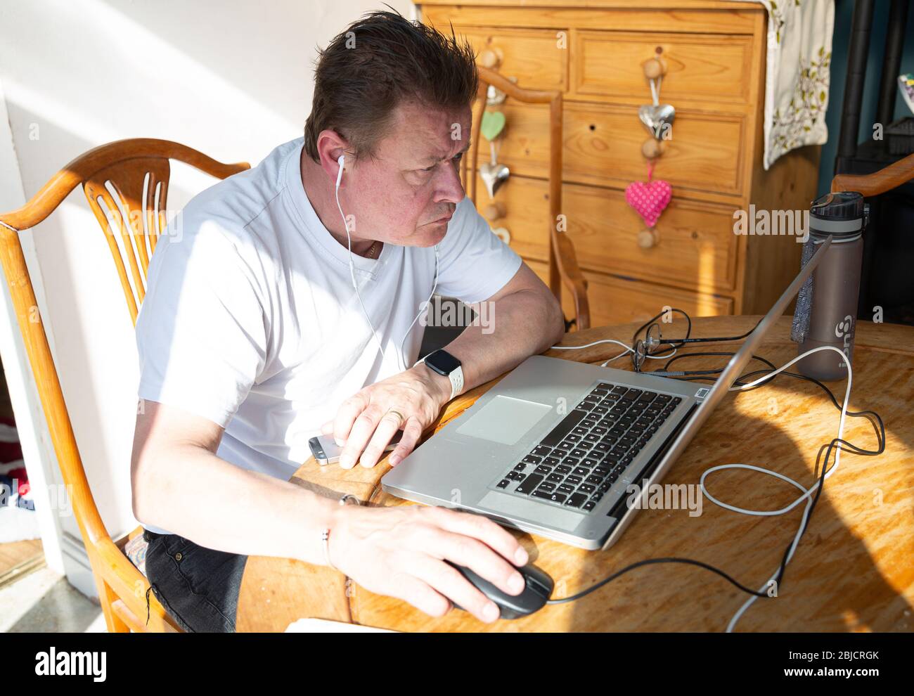 Middle aged man works from home Stock Photo - Alamy