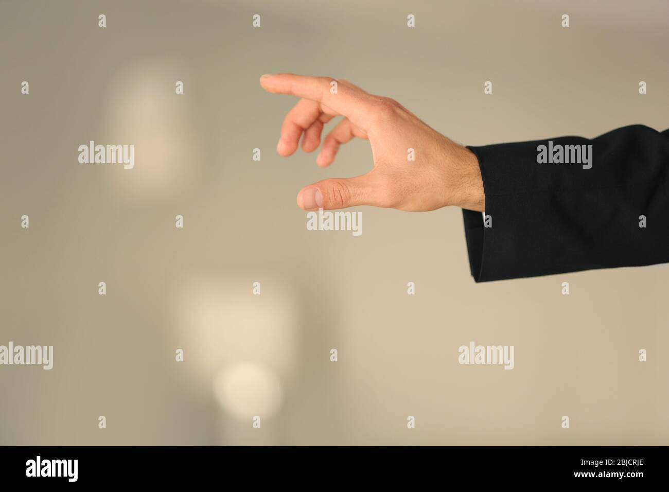 Male hand with finger pointing on blurred background Stock Photo - Alamy