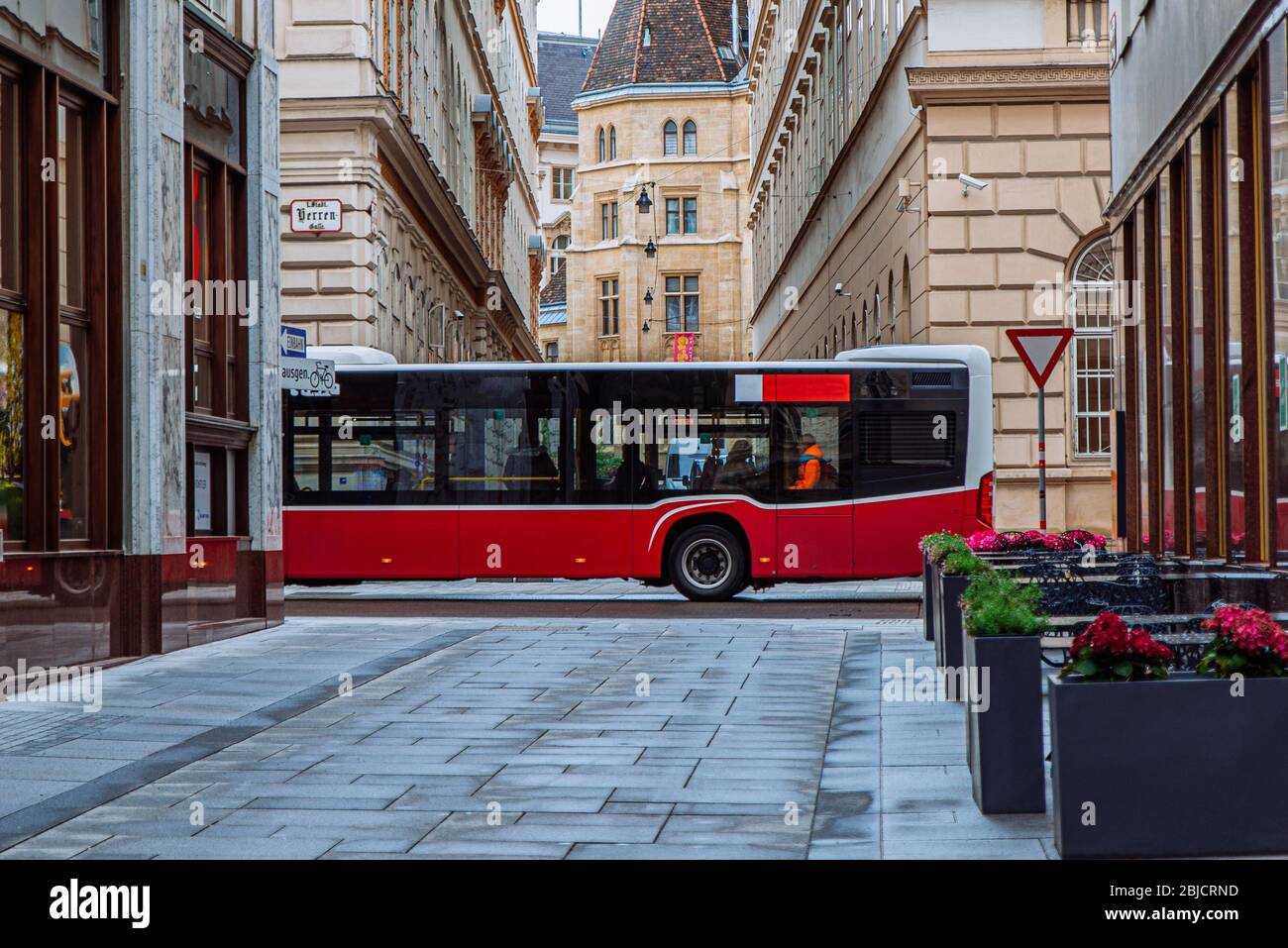 red public city bus at vienna street Stock Photo - Alamy