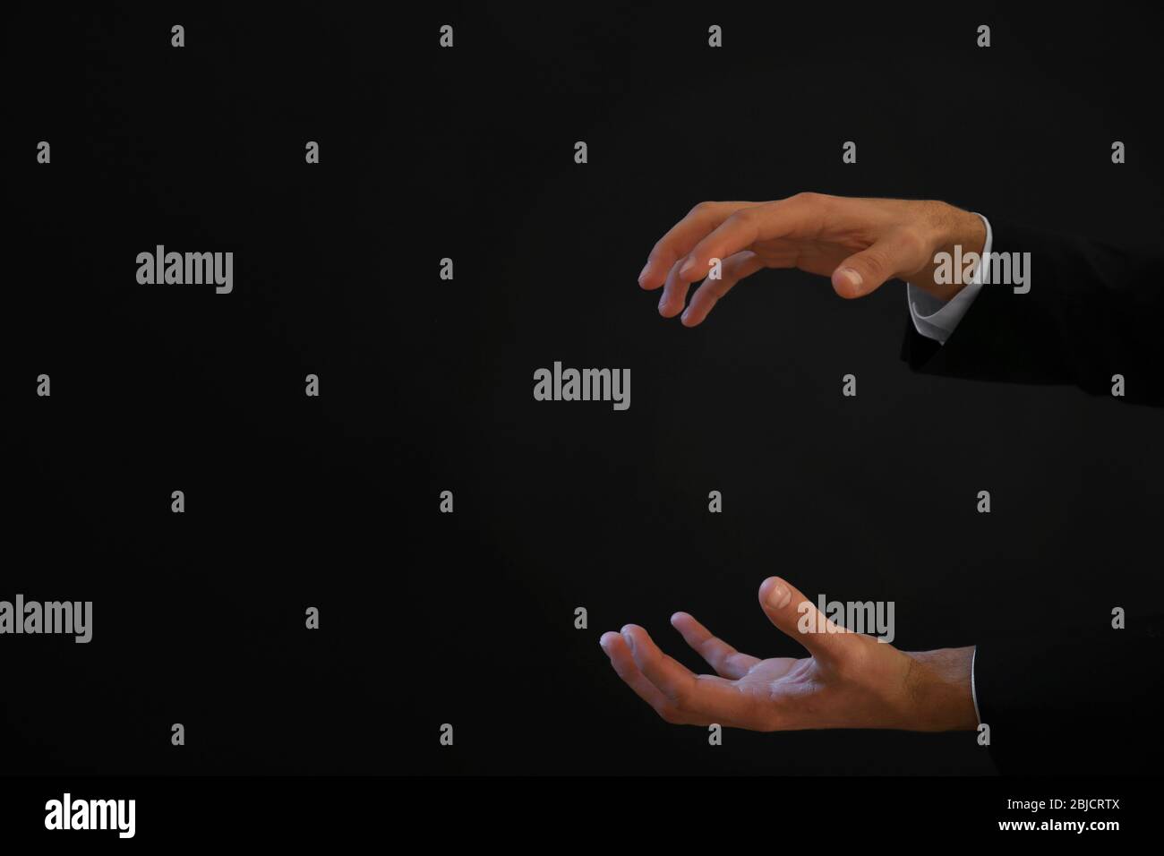 Black hands show something hi-res stock photography and images - Alamy