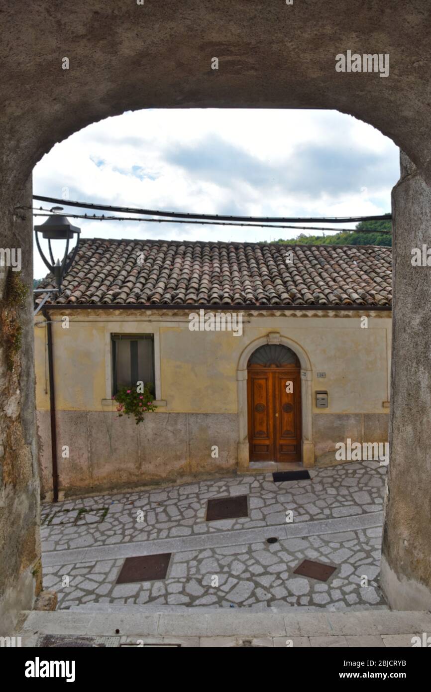 A small road between the houses of the village of Guardia Lombardi in ...