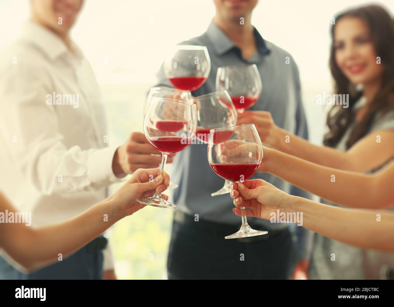 People toasting with glasses of red wine, closeup Stock Photo - Alamy