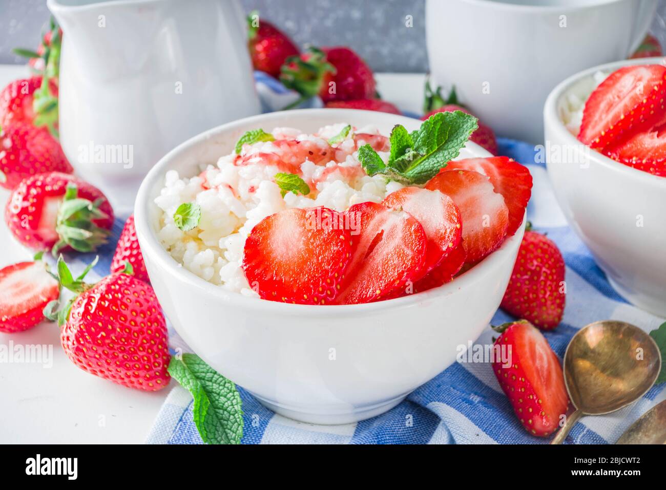Summer morning rice pudding or rice porridge with strawberry and berry ...
