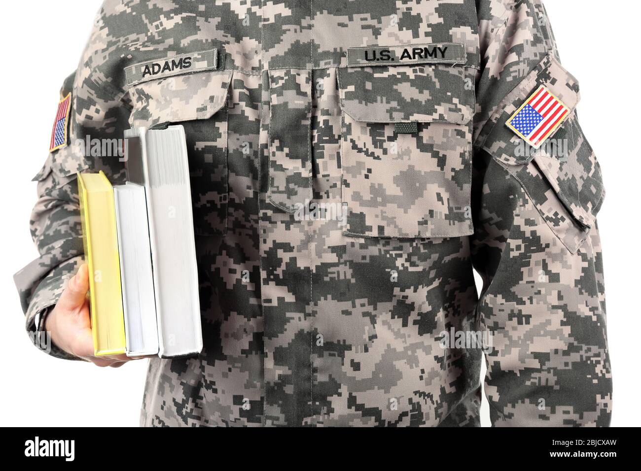 Soldier holding books. Military education concept Stock Photo - Alamy