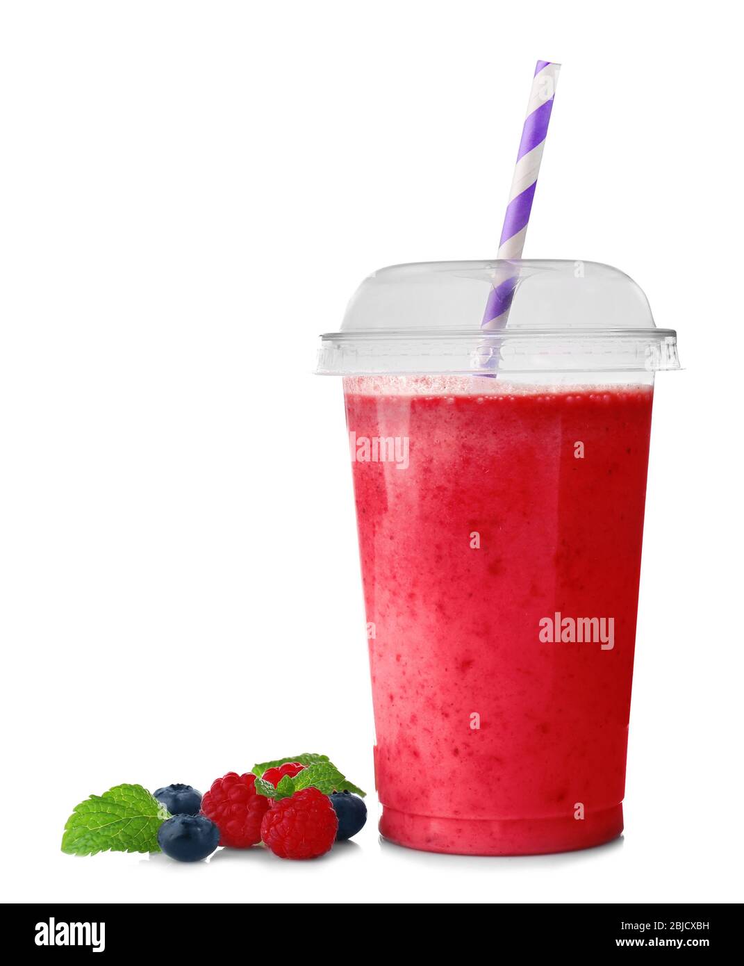 Delicious berry milkshake in plastic cup isolated on white Stock Photo ...