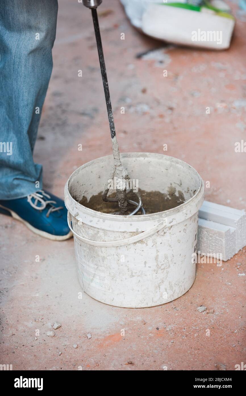 Closeup of repairman in uniform, professional builder working using ...