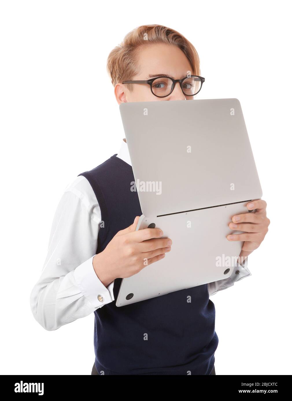 Teenage boy holding laptop on white background Stock Photo - Alamy