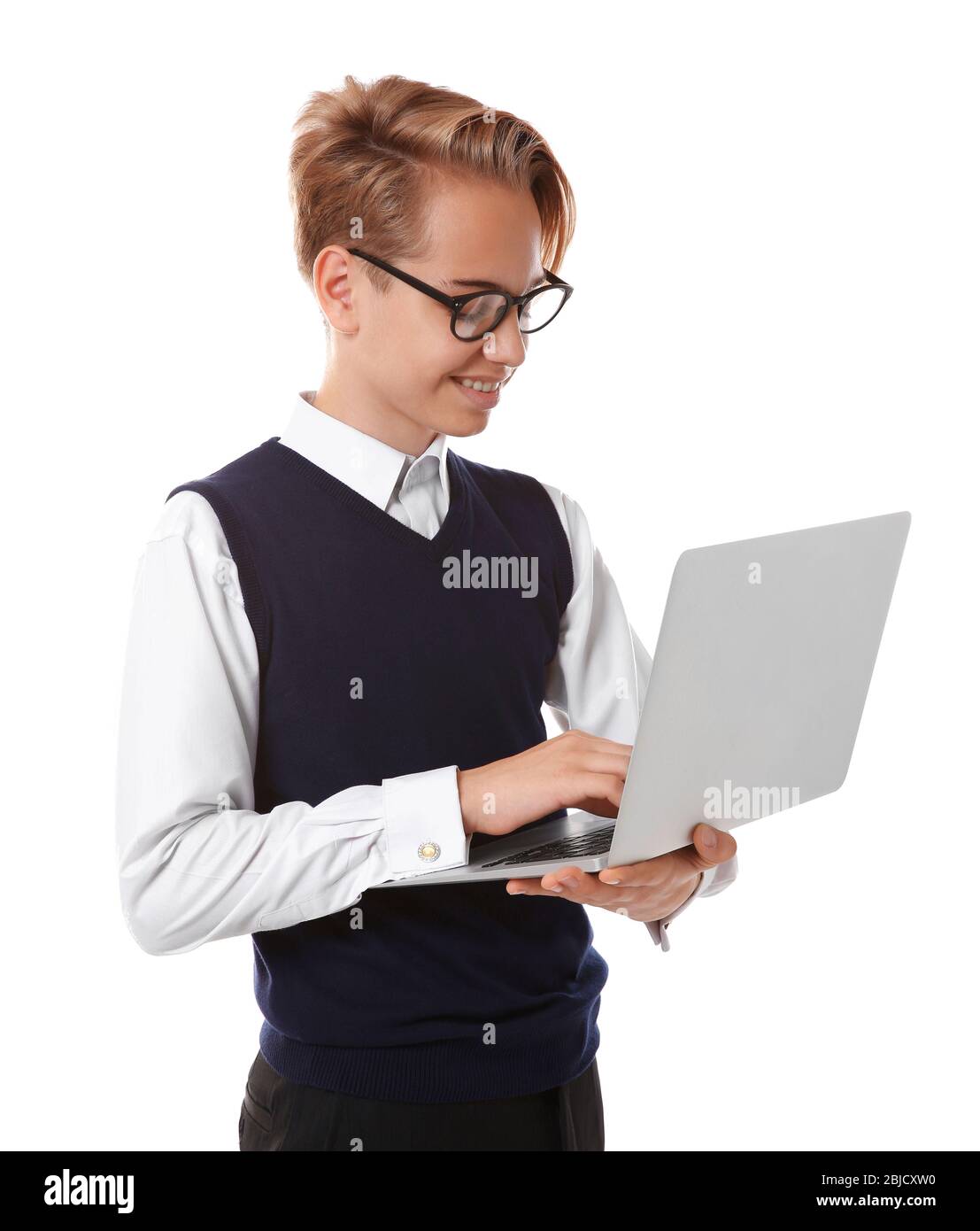Teenage boy holding laptop on white background Stock Photo - Alamy