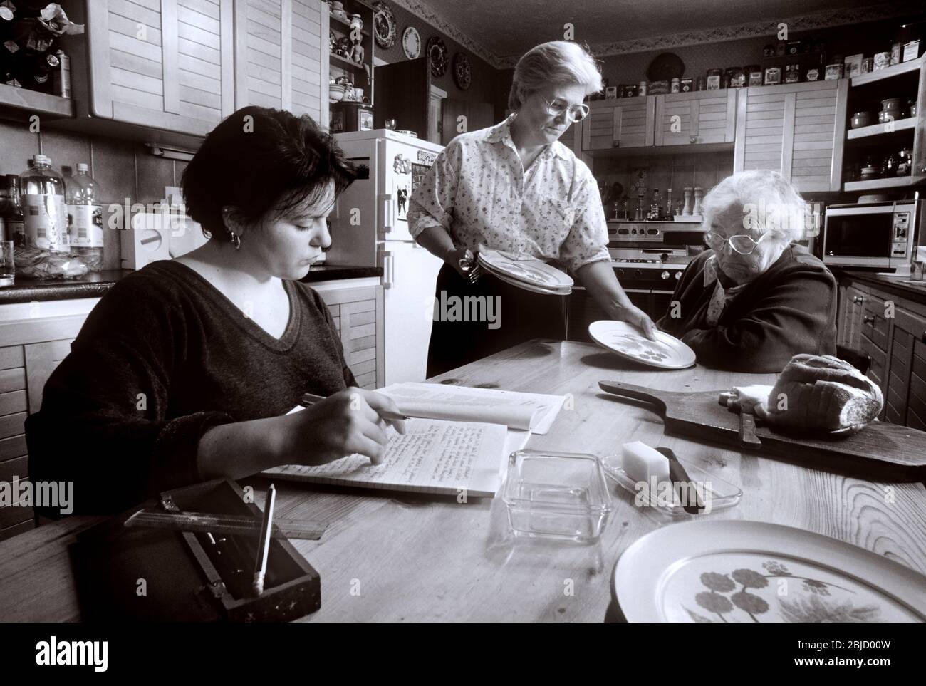 3 three generations busy living together under same roof hi-res stock ...
