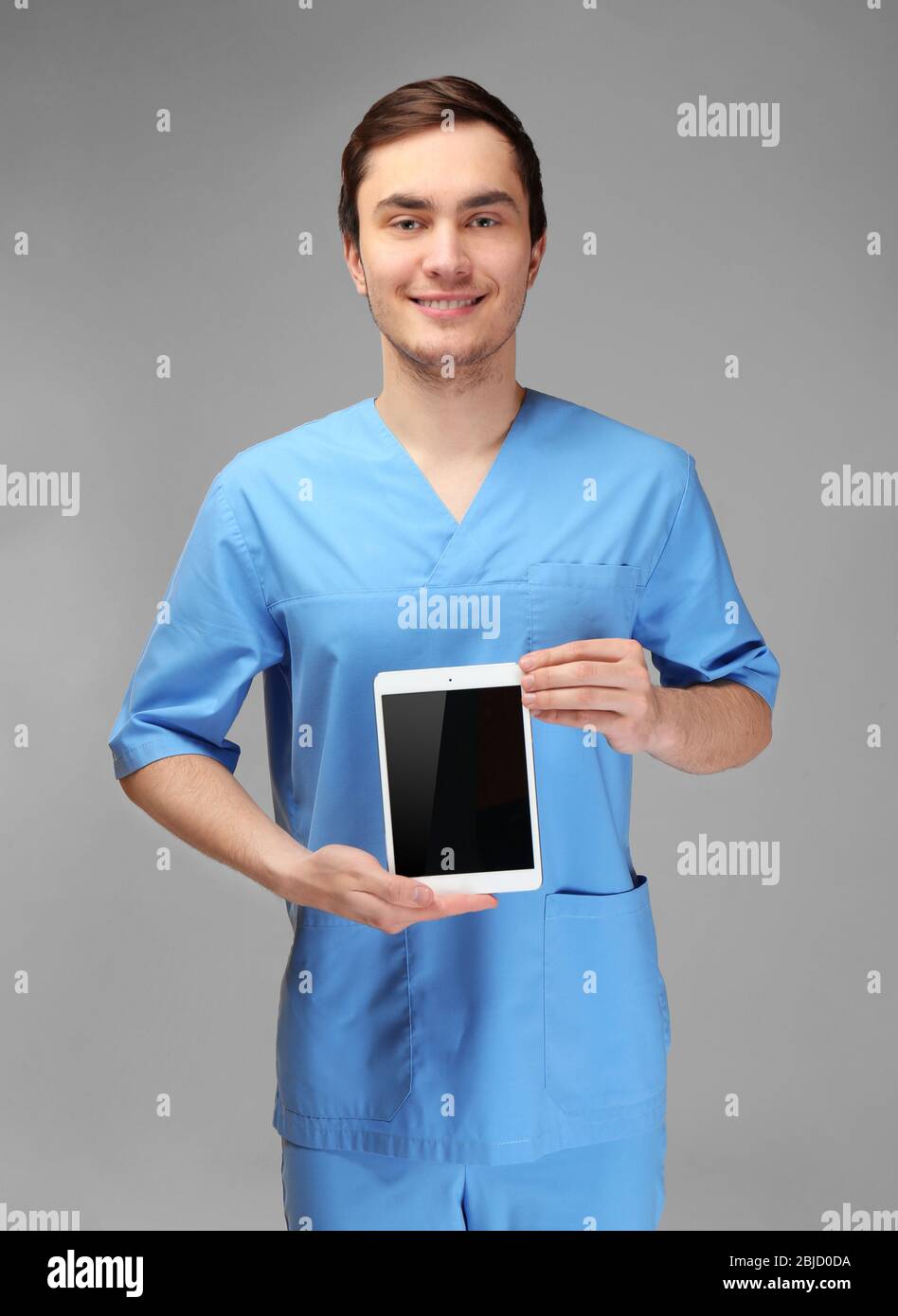 Handsome friendly male doctor tablet hi-res stock photography and ...