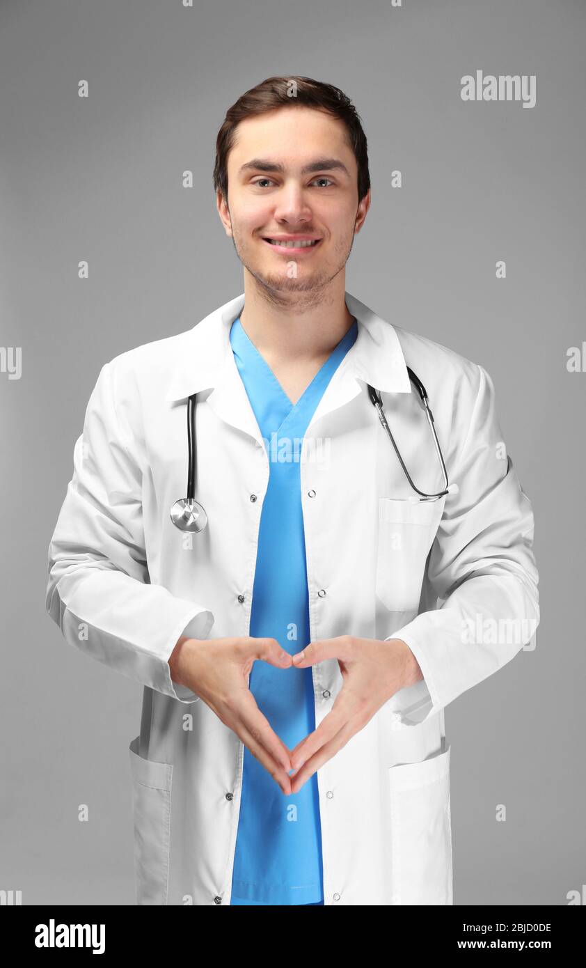 Friendly young cardiologist doctor heart hi-res stock photography and ...