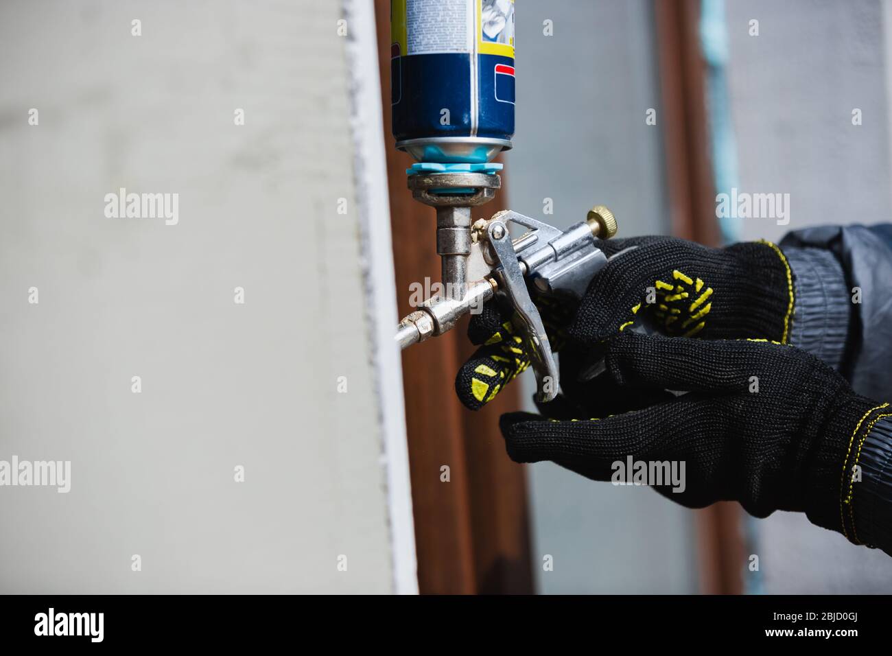 Closeup of repairman in uniform, professional builder working using ...