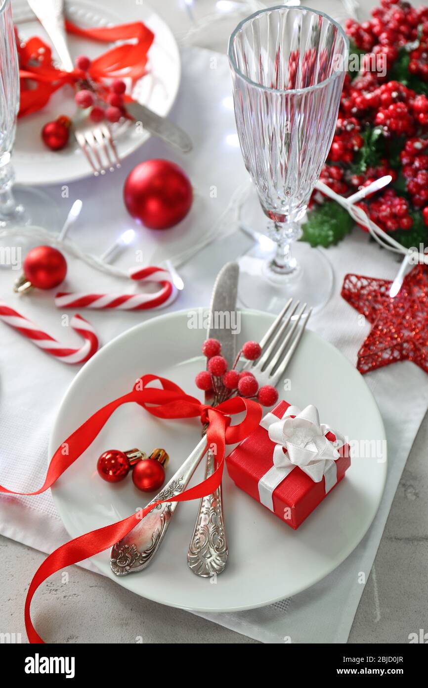 Beautiful Christmas table setting with decorations Stock Photo - Alamy