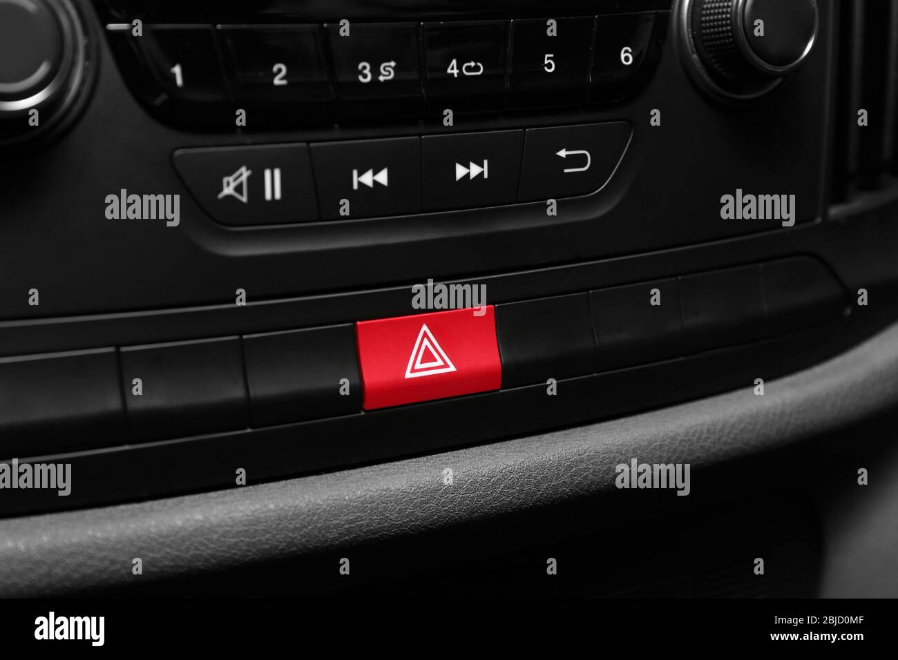 Emergency warning button on car console, closeup Stock Photo - Alamy