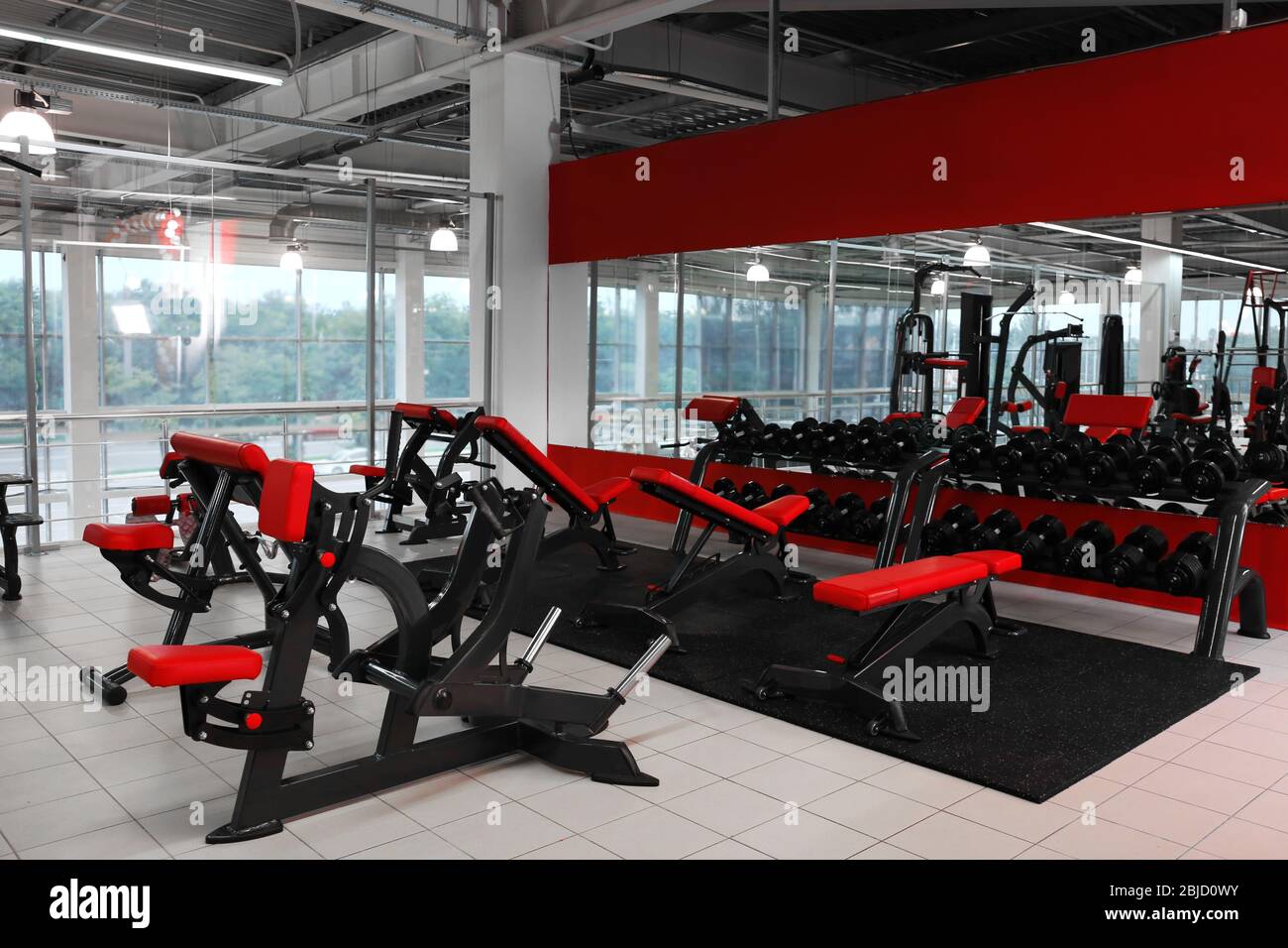 Weight lifting machines in gym Stock Photo - Alamy