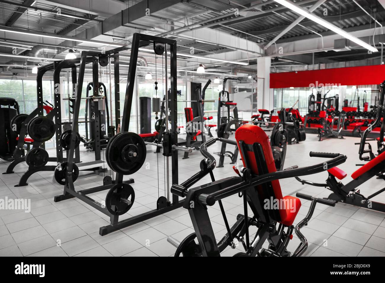 Weight lifting machines in gym Stock Photo - Alamy