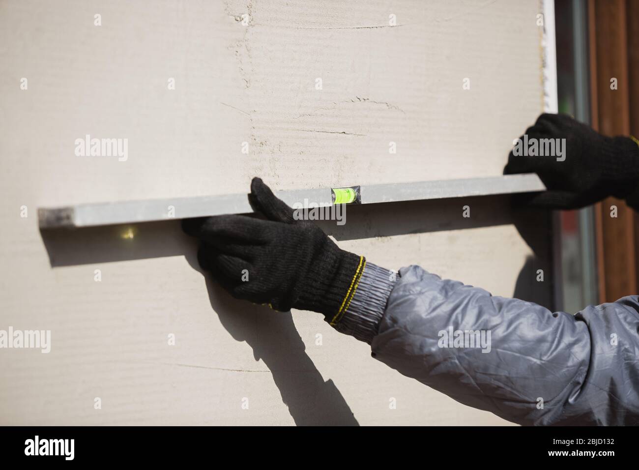 Closeup of repairman in uniform, professional builder working using ...