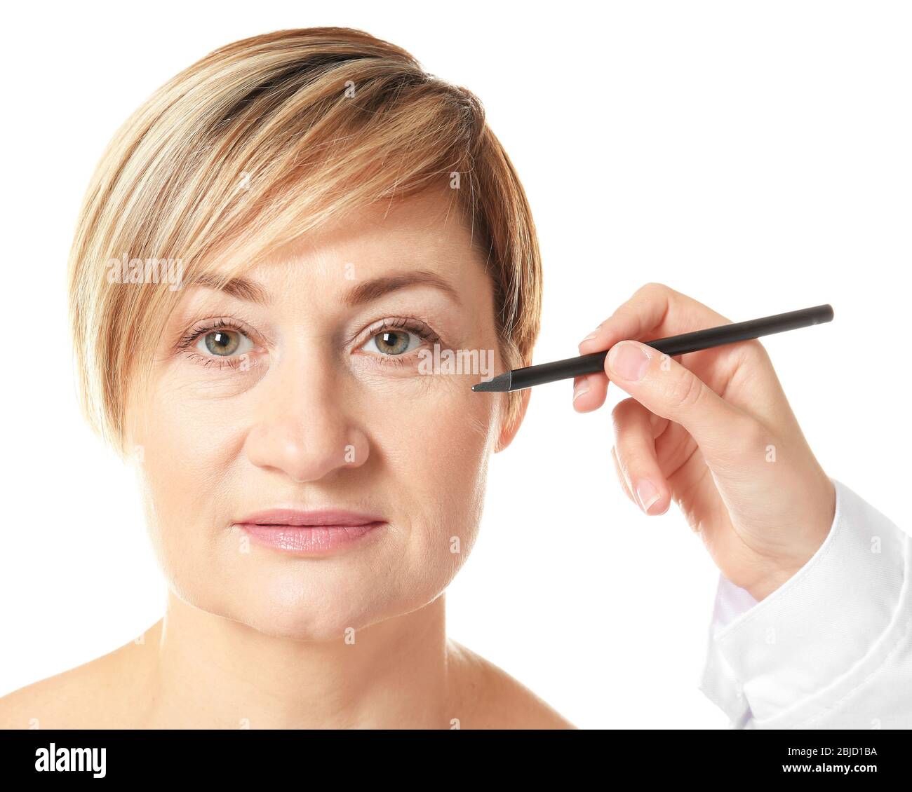 Surgeon hand drawing marks on female face for plastic operation Stock ...