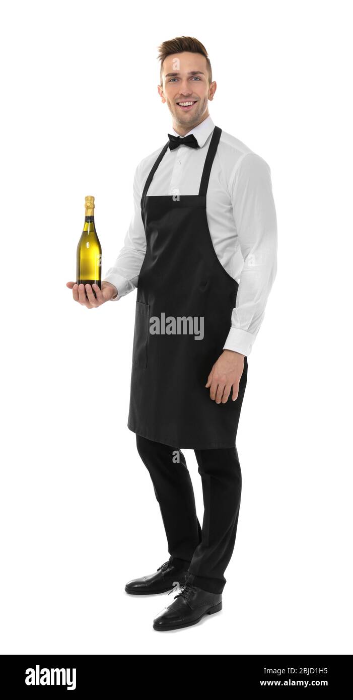 Handsome young waiter with bottle of champagne on white background ...