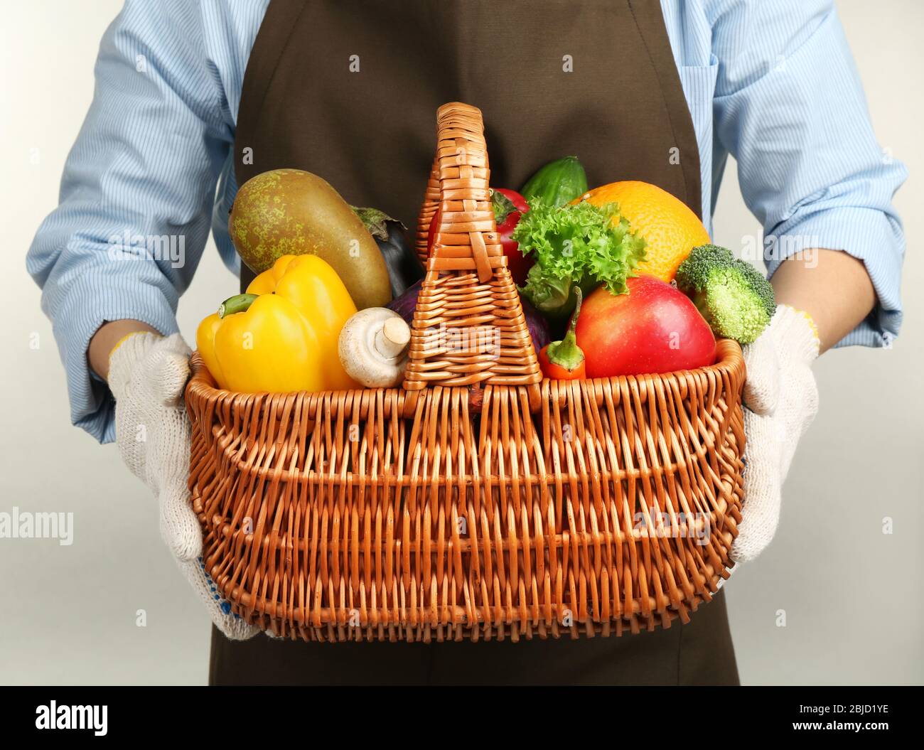 Hands holding wicker basket hi-res stock photography and images - Alamy