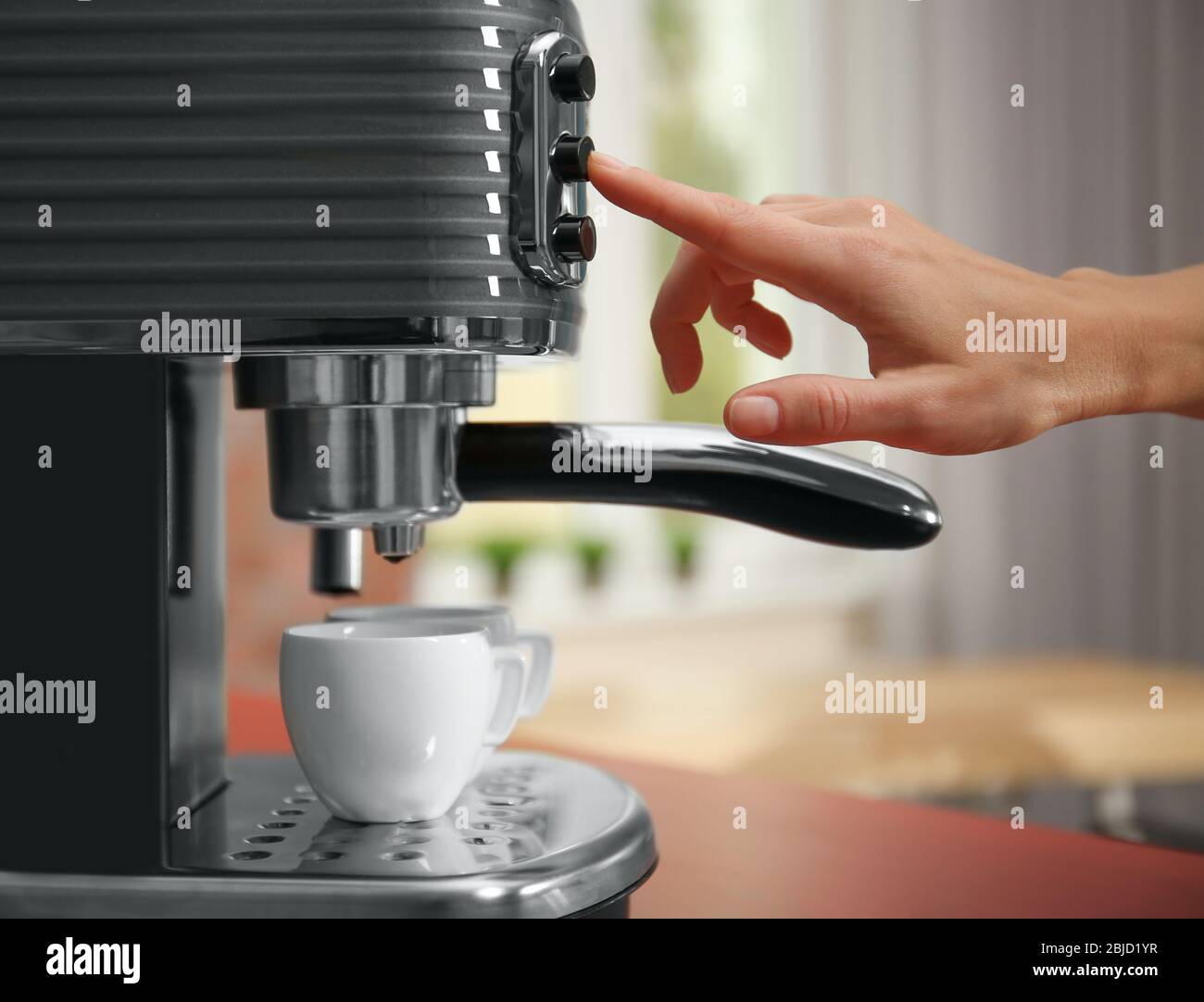 Female hand pushing button on electric coffee maker, closeup Stock ...
