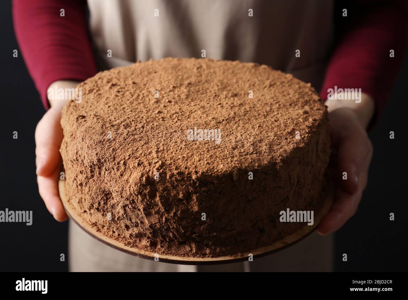 Woman baker holding cake hi-res stock photography and images - Alamy
