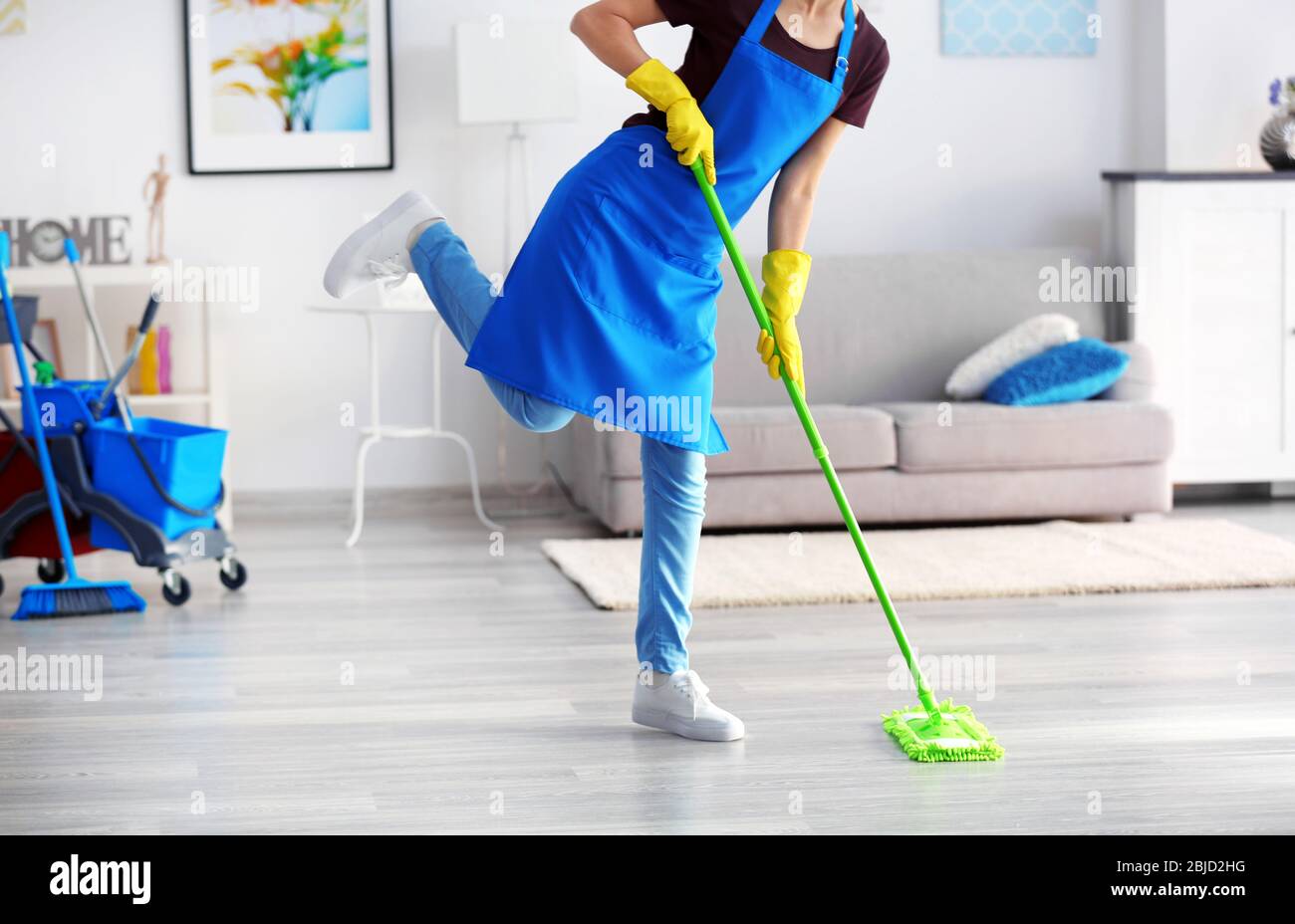 Woman moping her home hi-res stock photography and images - Alamy