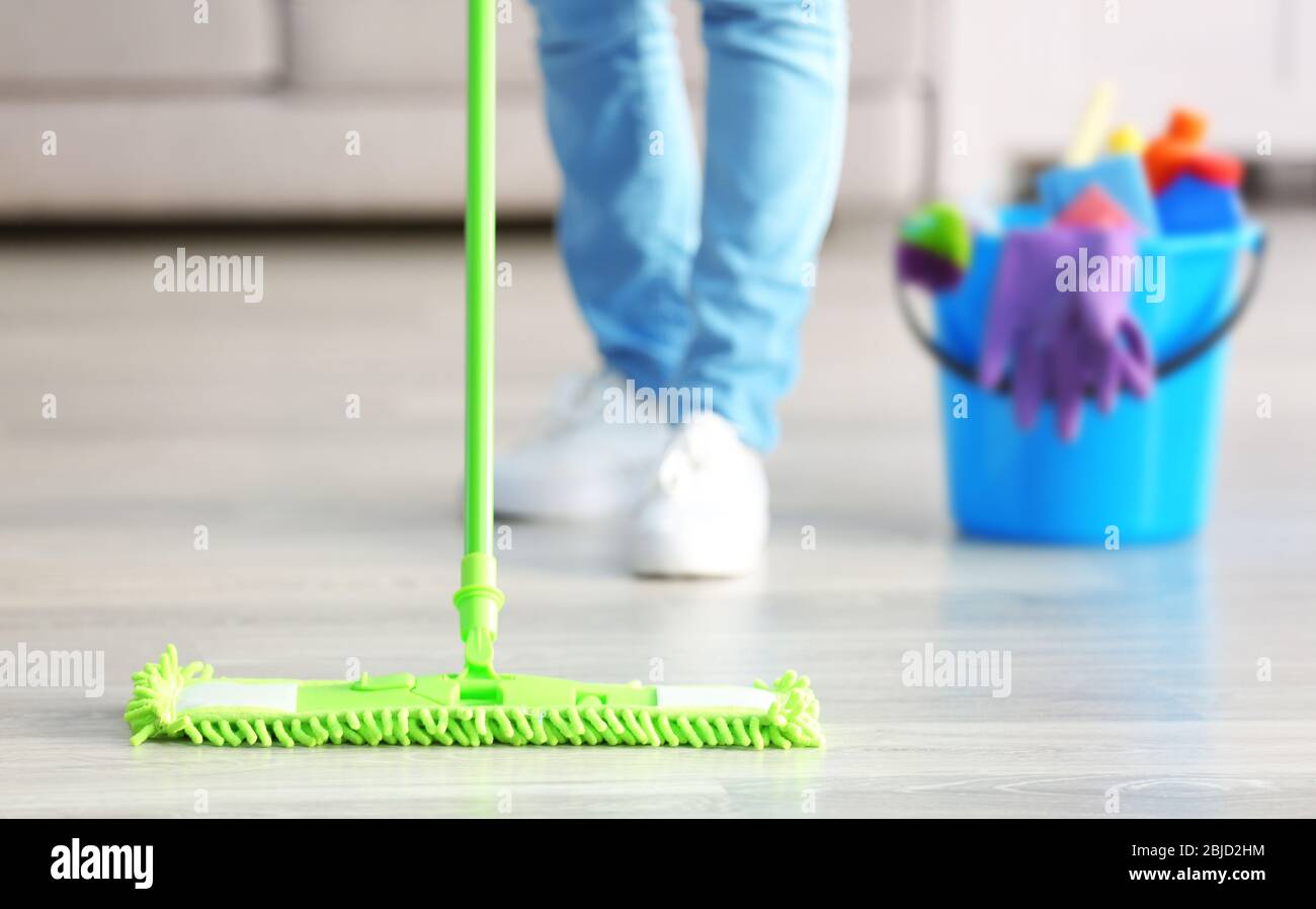 Woman moping the floor hi-res stock photography and images - Alamy