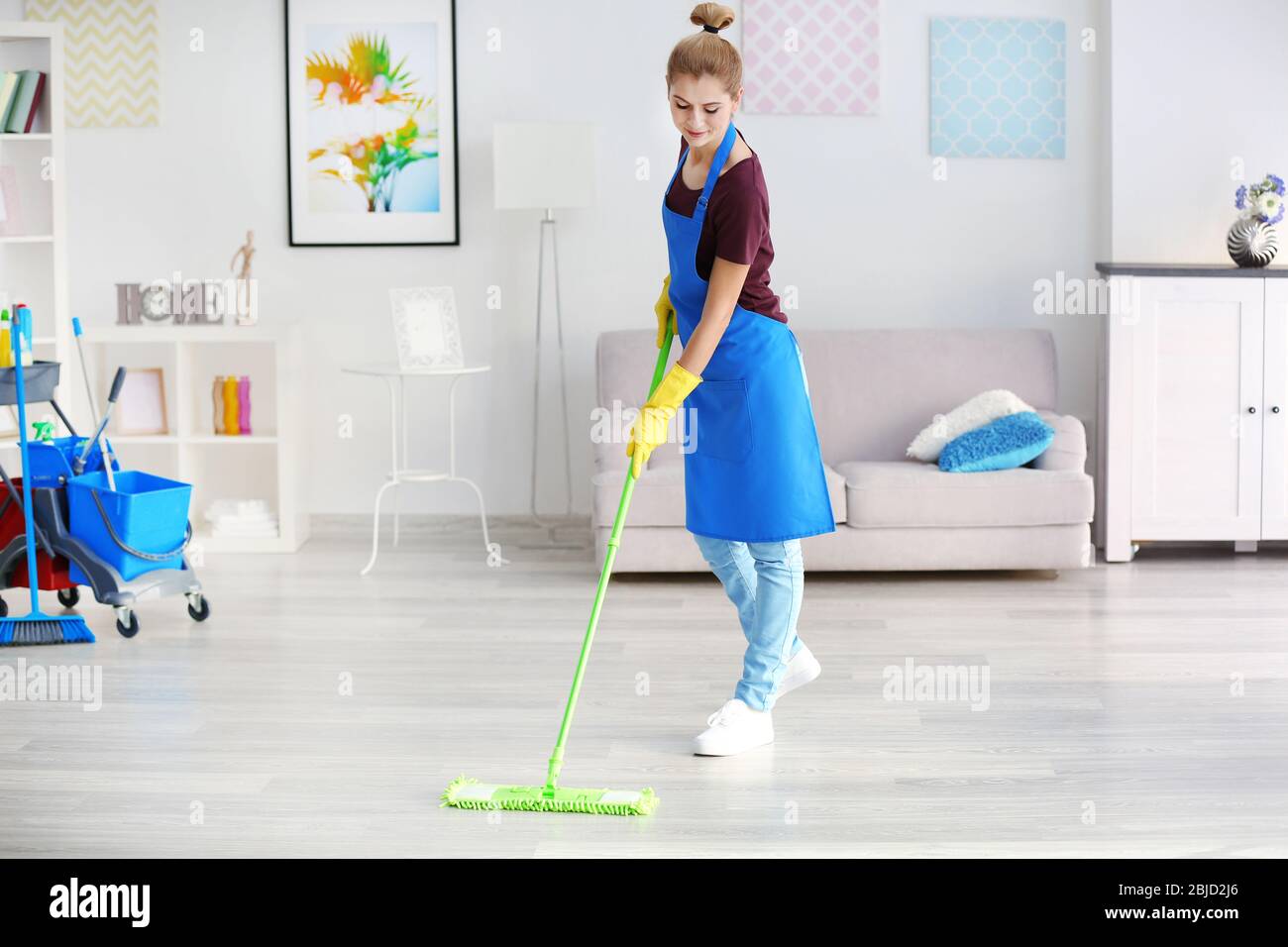 Woman moping the floor hi-res stock photography and images - Alamy