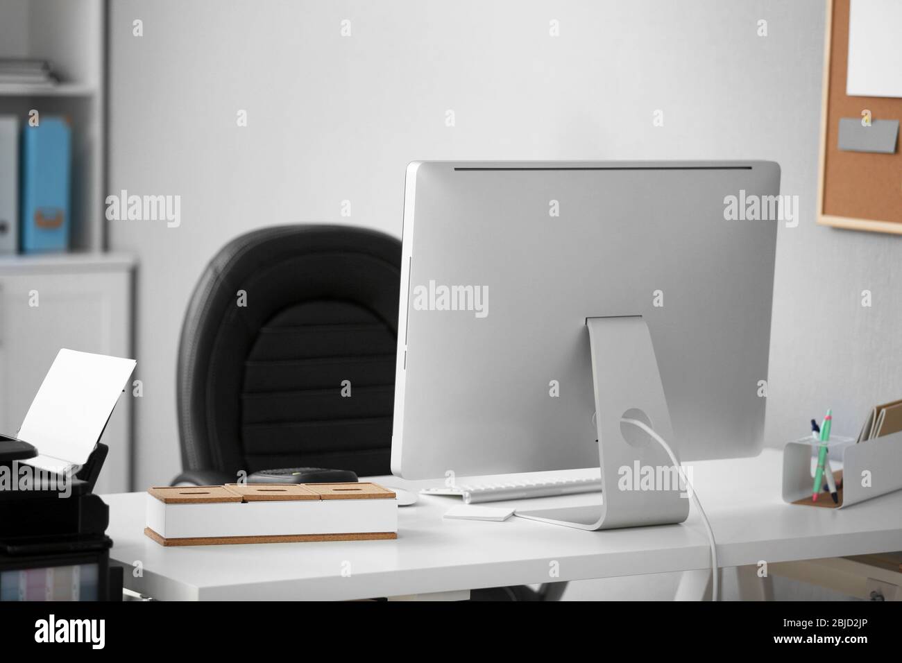 Workplace with computer in modern office Stock Photo - Alamy