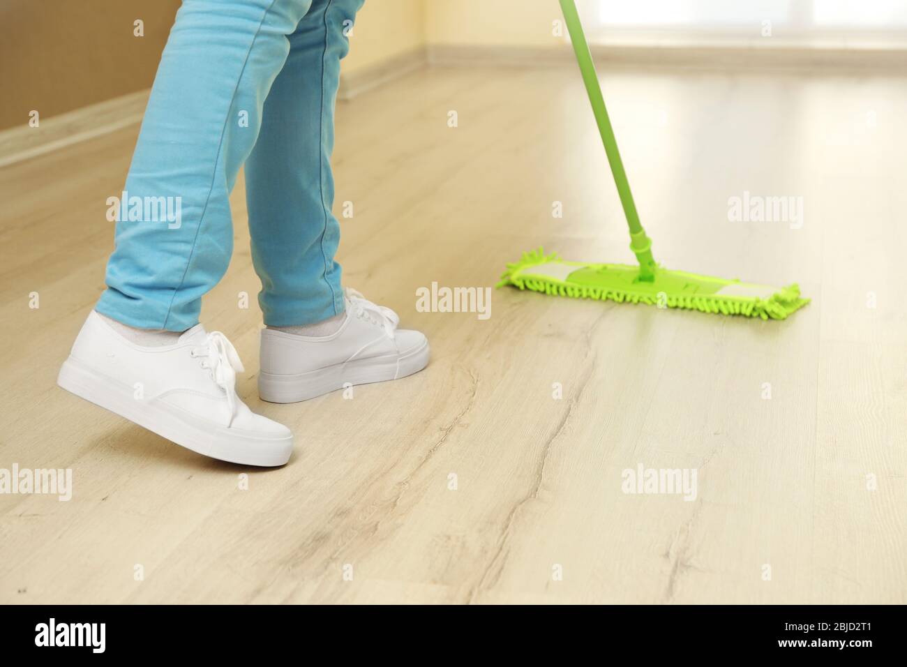 Woman moping the floor hi-res stock photography and images - Alamy