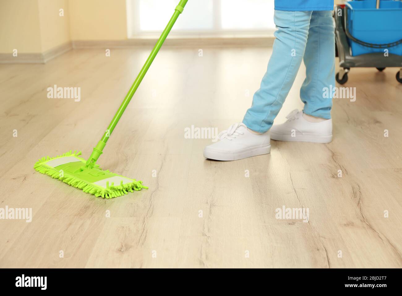 Woman moping her home hi-res stock photography and images - Alamy