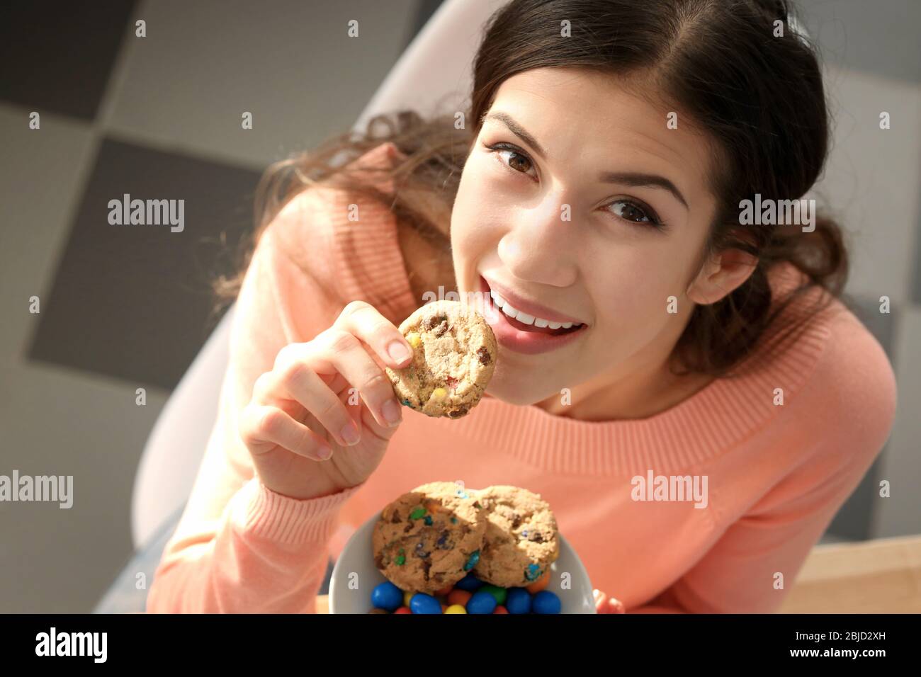 Pretty woman eating cookies hi-res stock photography and images - Alamy