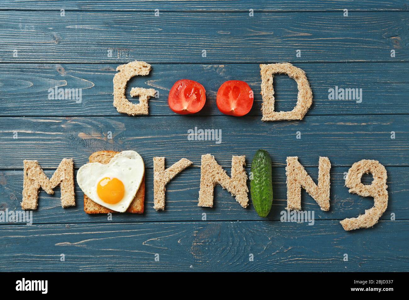 Words GOOD MORNING made with food on wooden background Stock Photo - Alamy