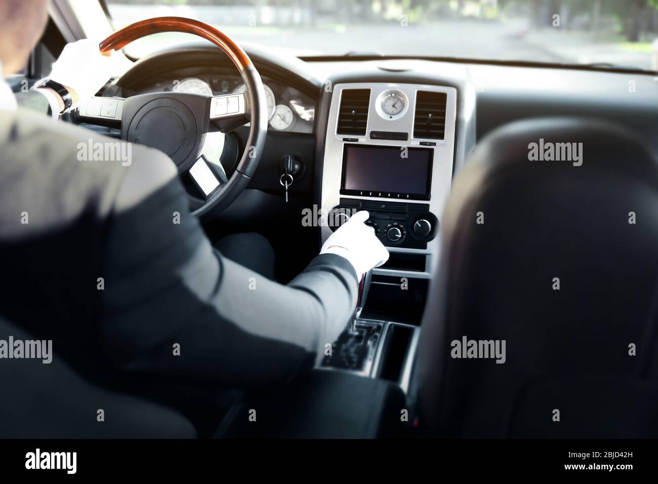 Chauffeur driving a car, view from inside Stock Photo - Alamy