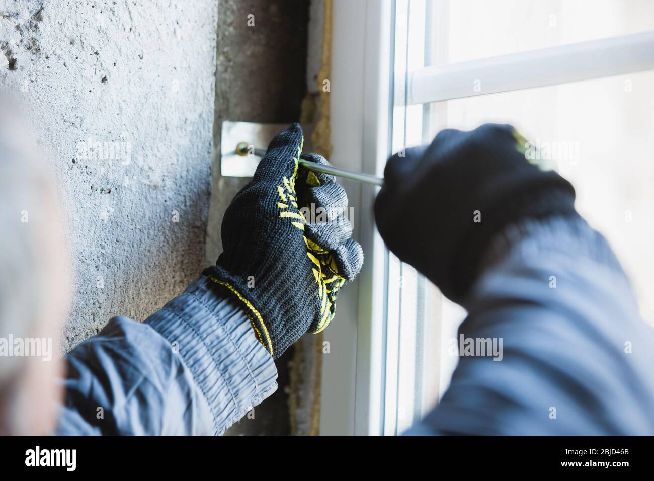 Closeup of repairman in uniform, professional builder working using ...