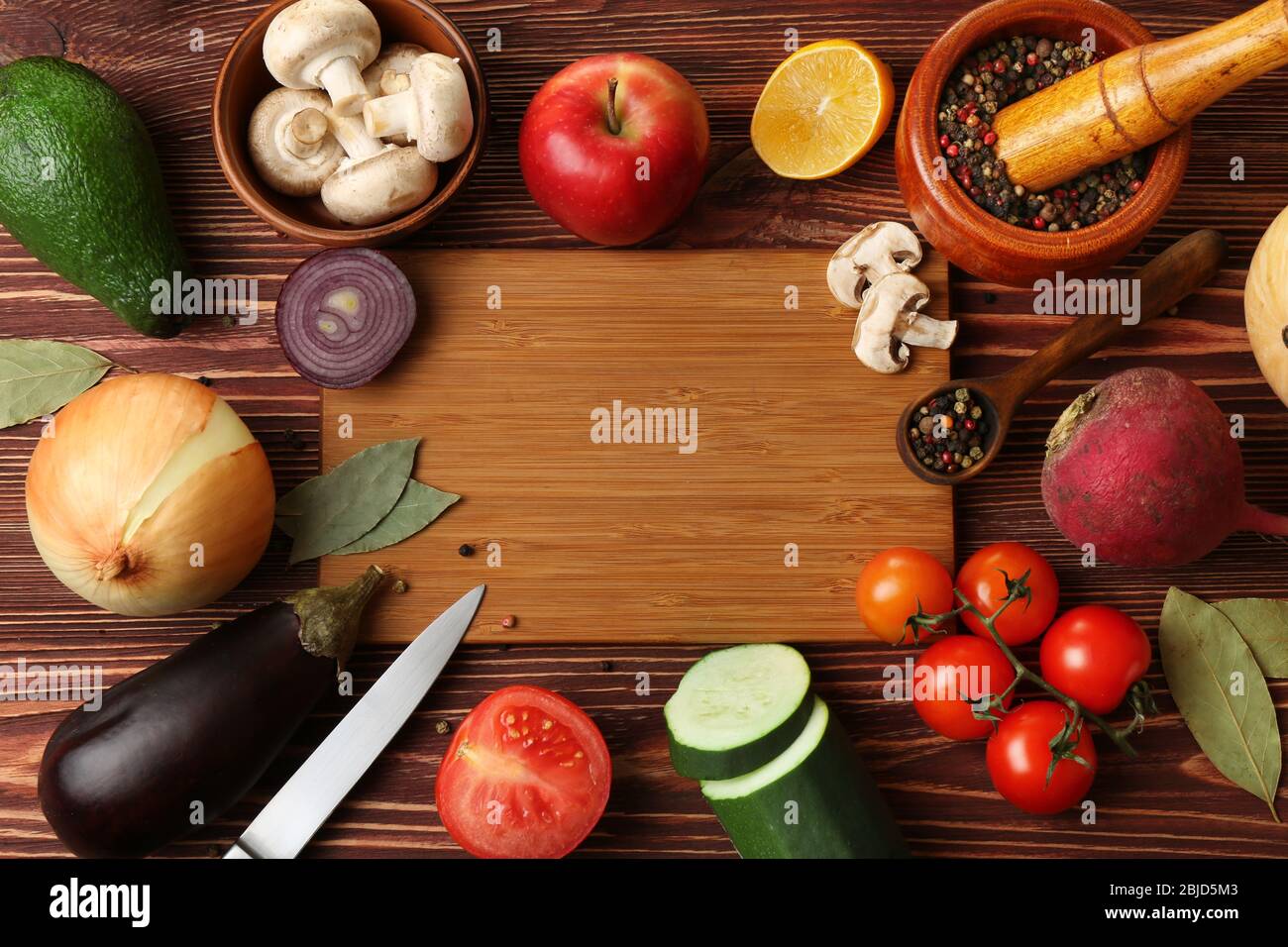 Variety of food products on kitchen table Stock Photo - Alamy